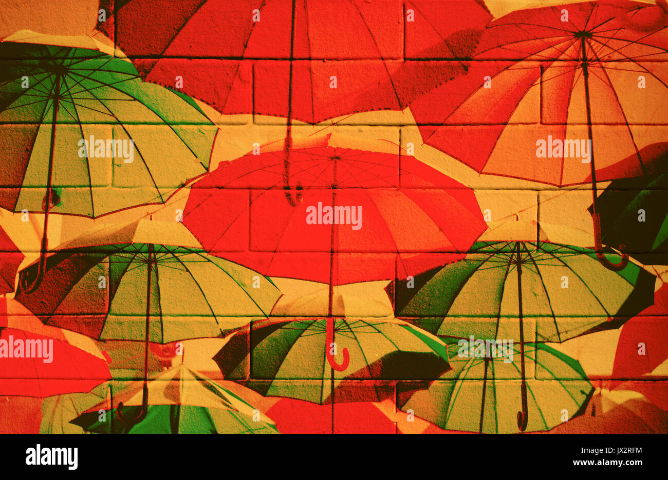 umbrellas on brick wall Stock Photo - Alamy