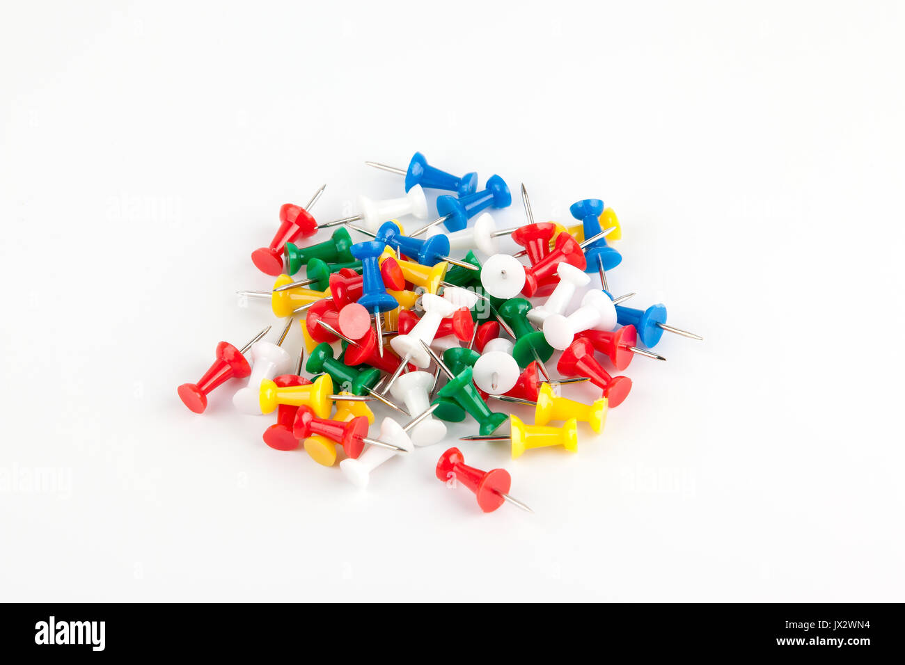 Colored pins isolated on white background. Stationery Stock Photo - Alamy