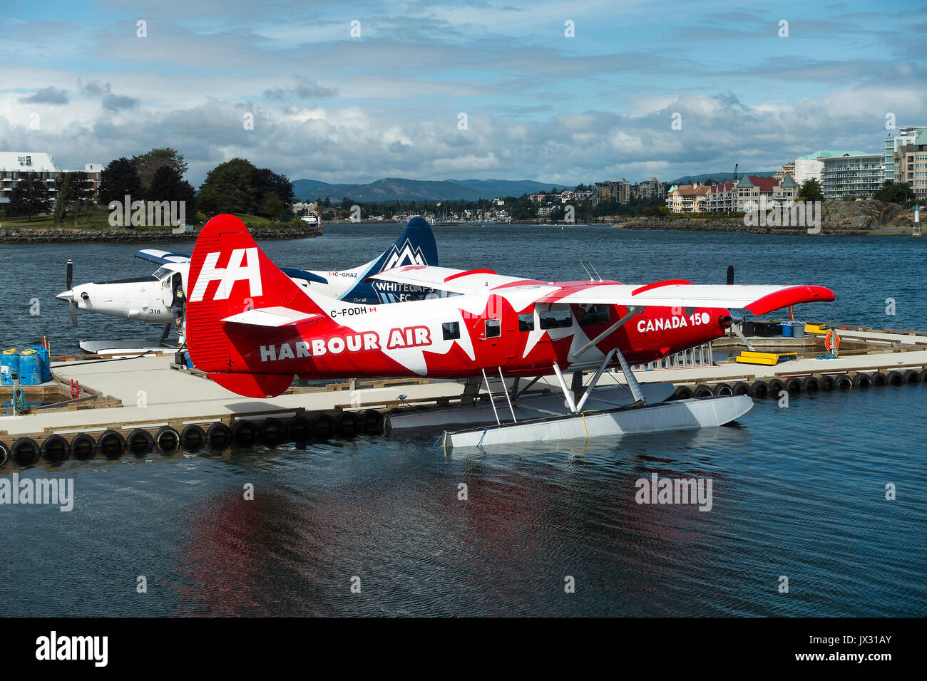 Colourful Seaplanes in the Inner Harbour Area of Victoria with Boats ...
