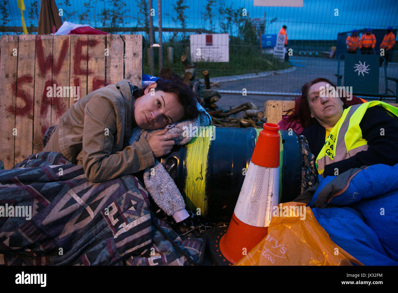 13 local activists locked themselves in specially made arm tubes to ...