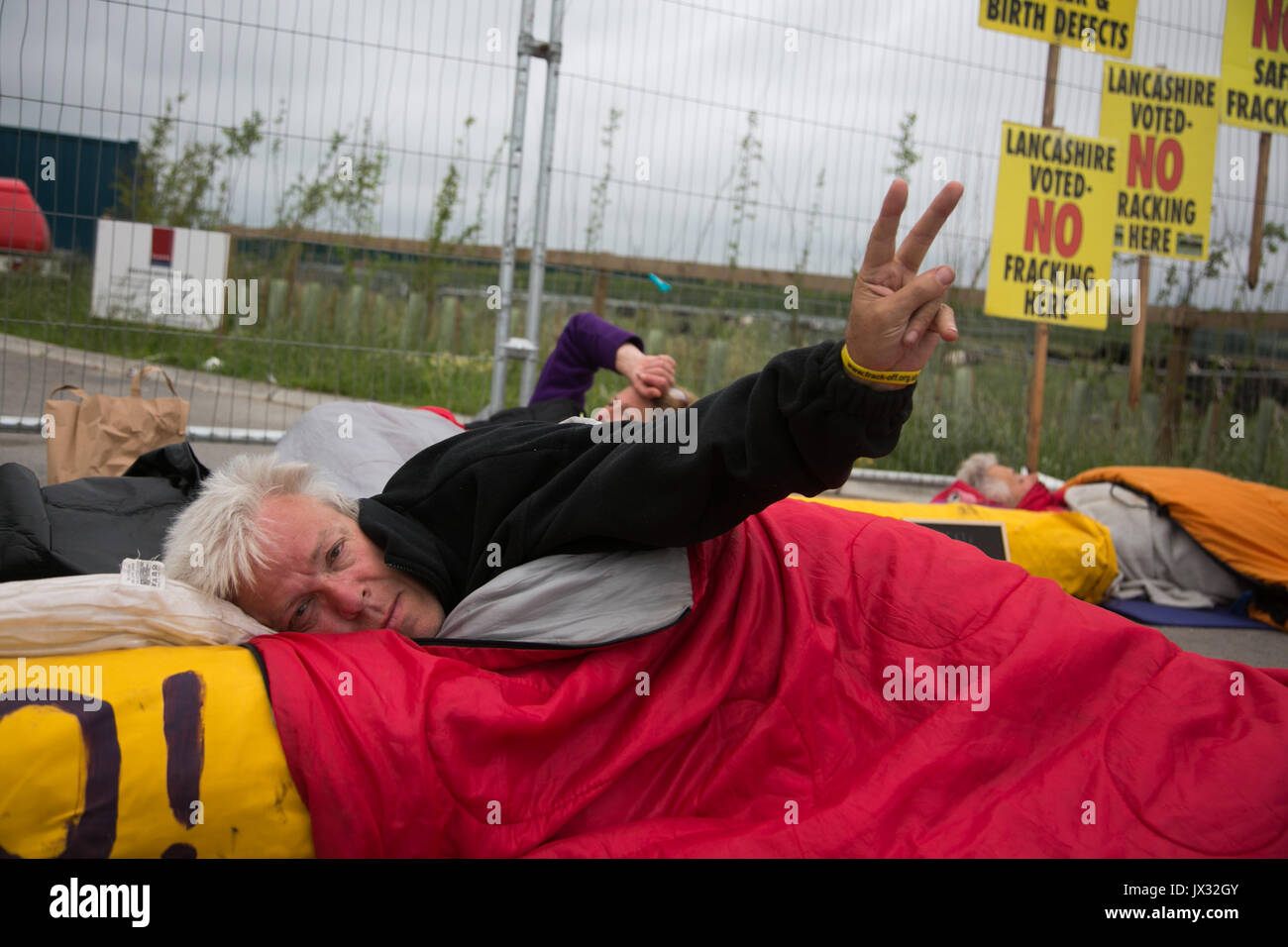 13 local activists locked themselves in specially made arm tubes to ...