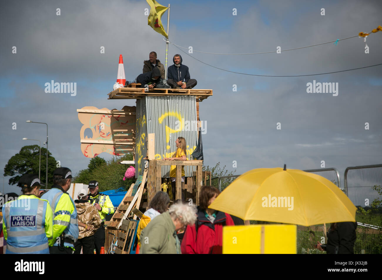 13 local activists locked themselves in specially made arm tubes to ...
