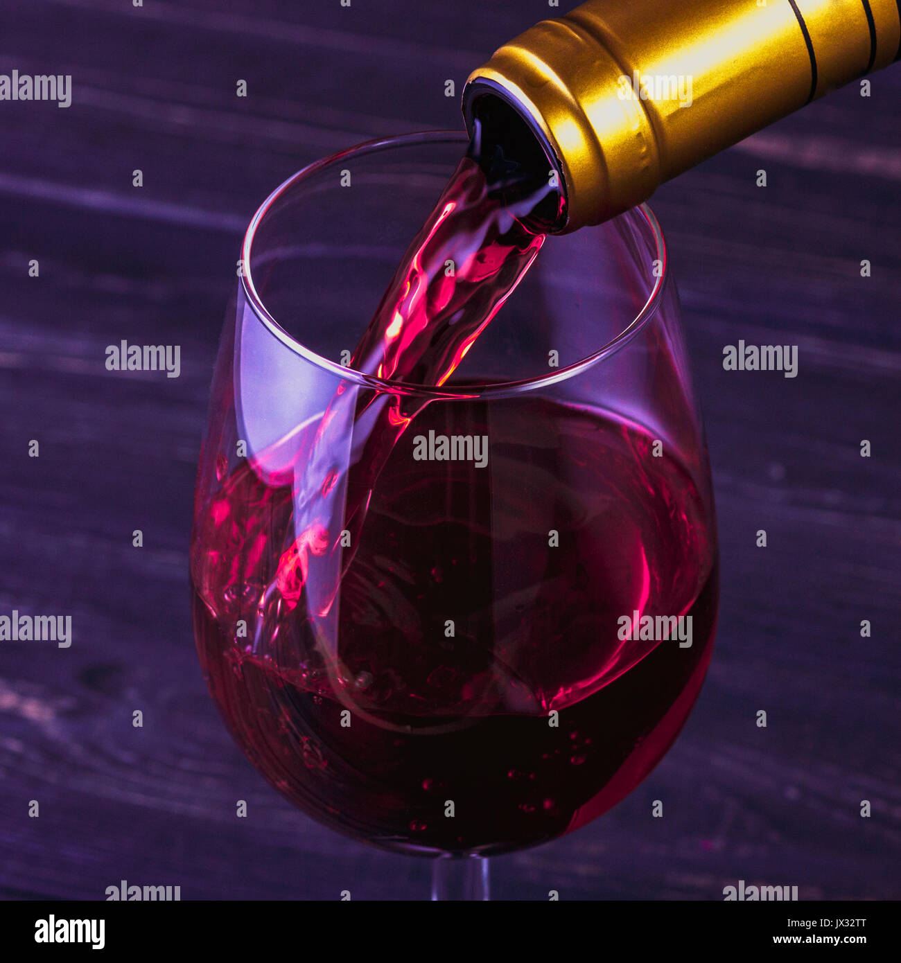 Pouring red wine Stock Photo - Alamy
