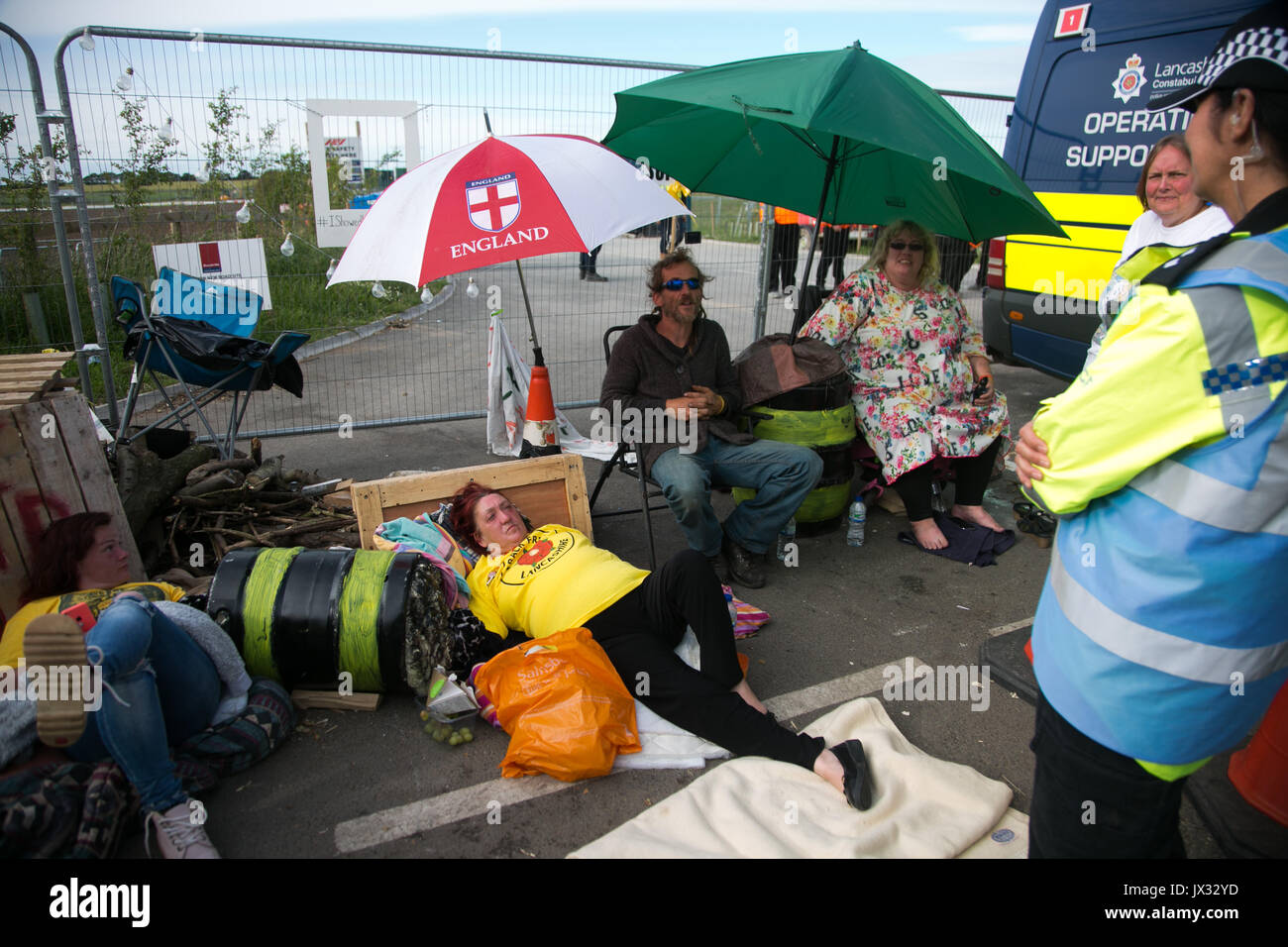 13 local activists locked themselves in specially made arm tubes to ...