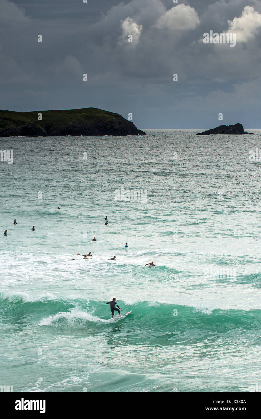 Surfing UK. A surfer riding a wave at Fistral in Newquay, Cornwall ...