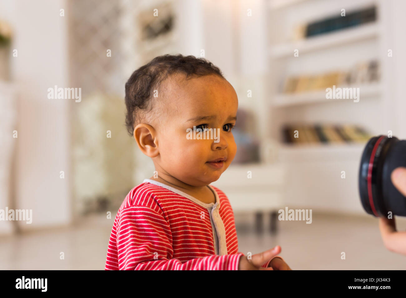 Cute curious baby in the room Stock Photo - Alamy