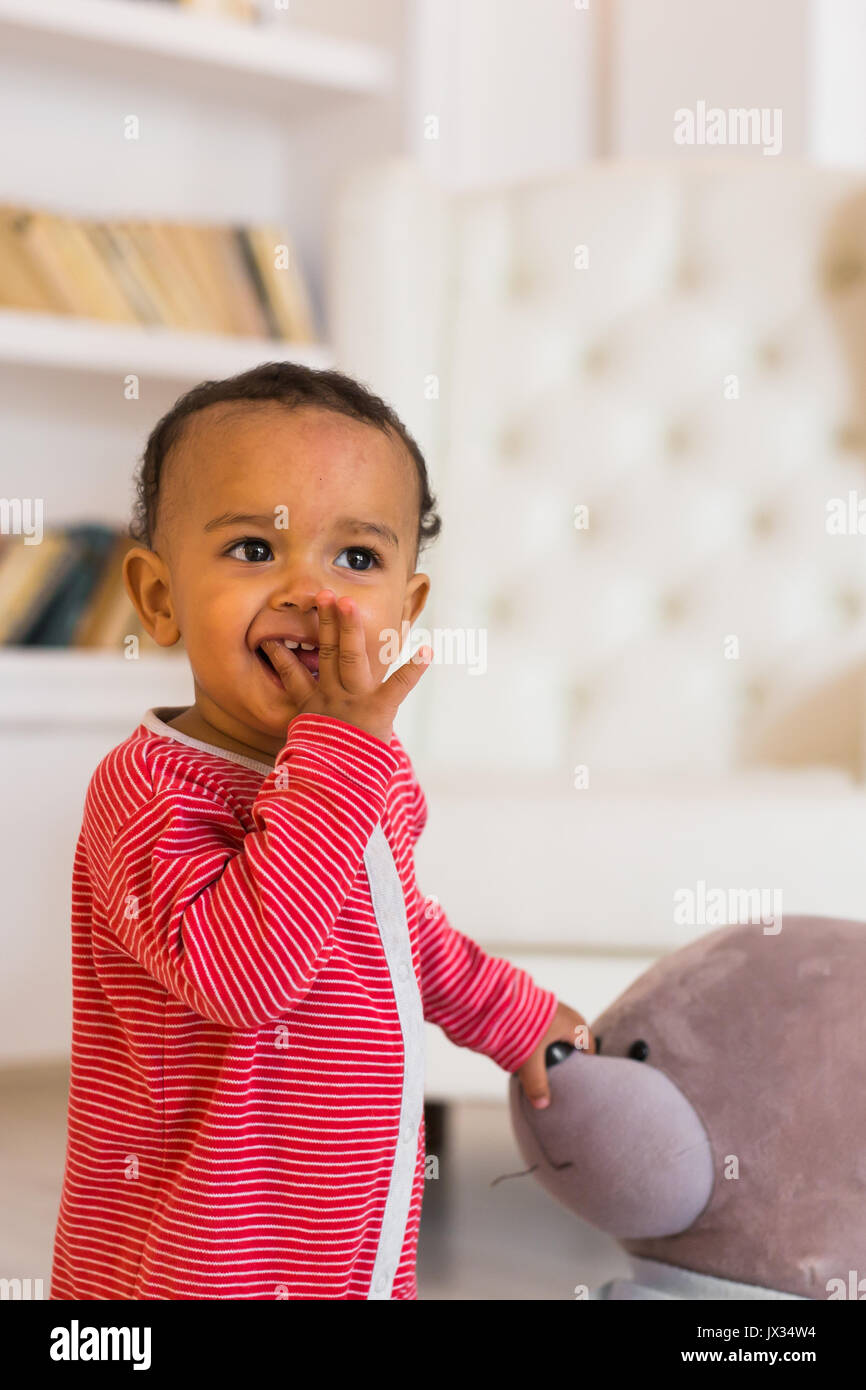 Cute curious baby in the room Stock Photo - Alamy