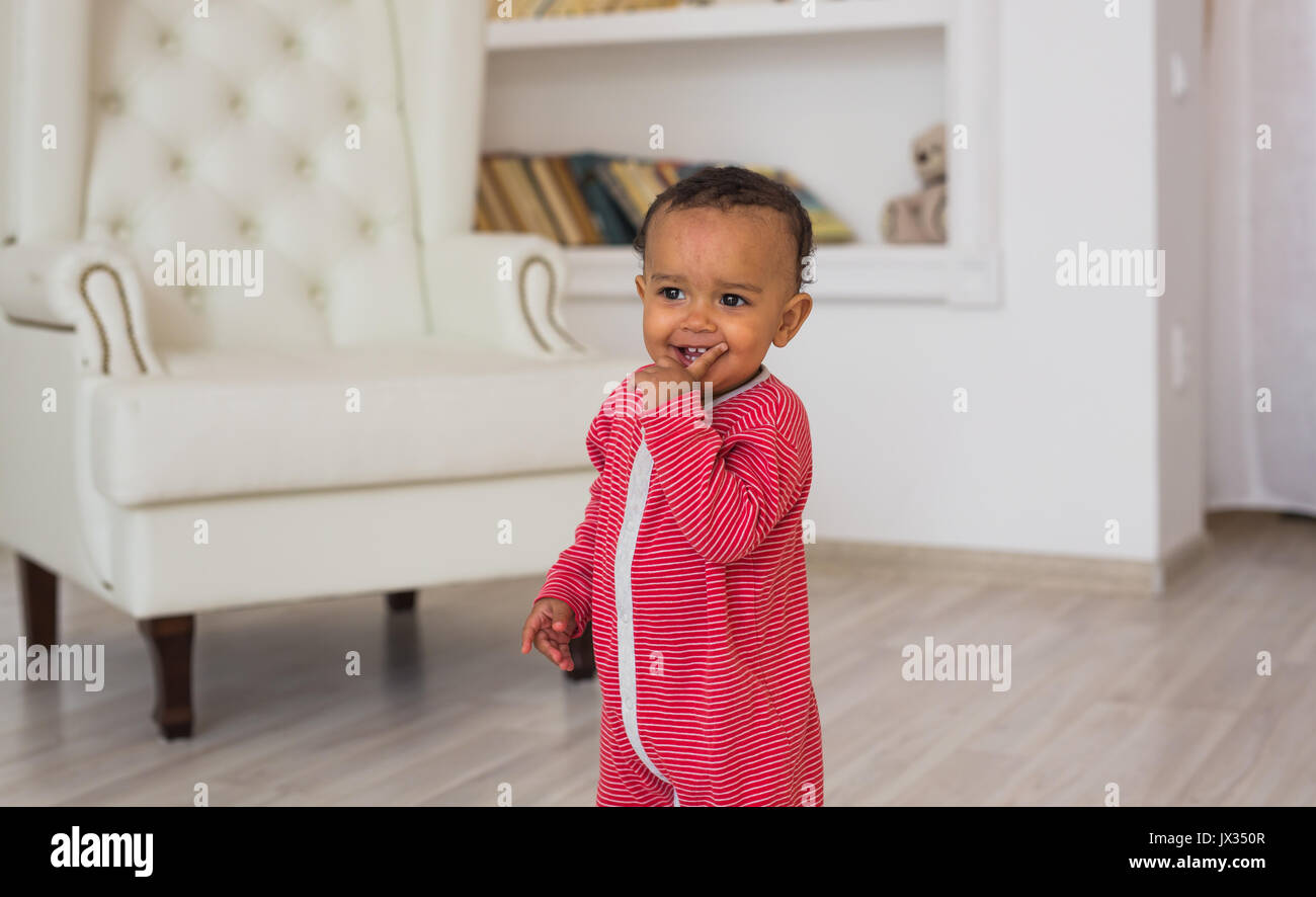 Cute curious baby in the room Stock Photo - Alamy
