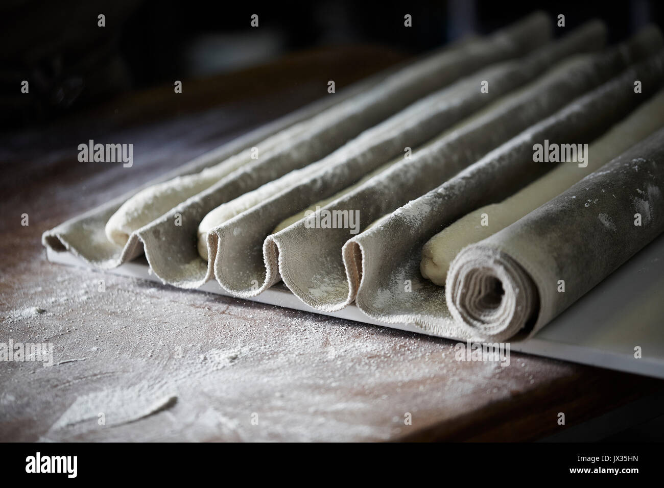 French sticks ready for baking Stock Photo - Alamy