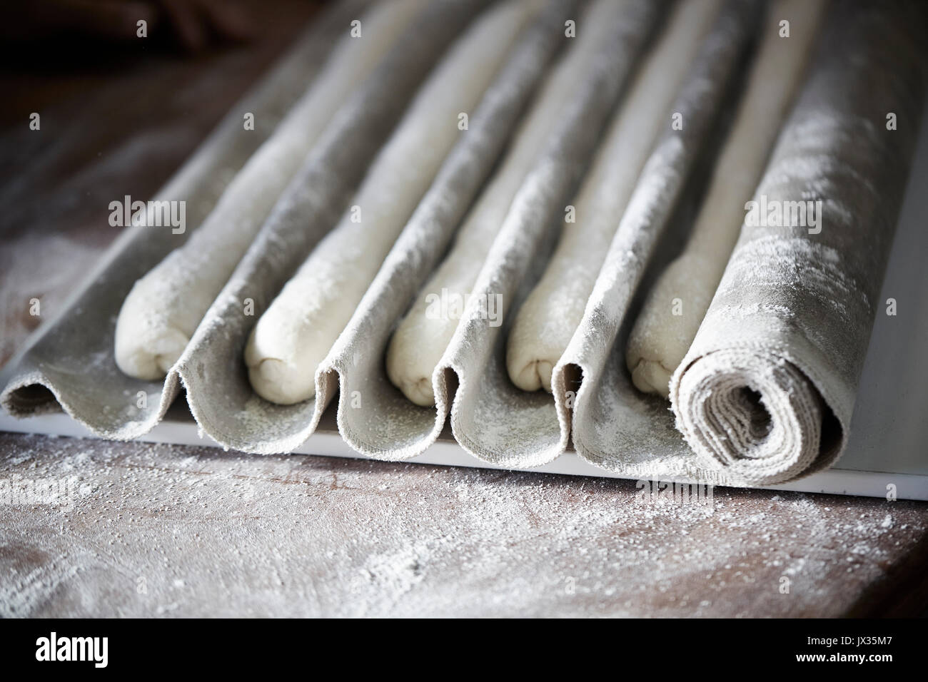 French sticks ready for baking Stock Photo - Alamy