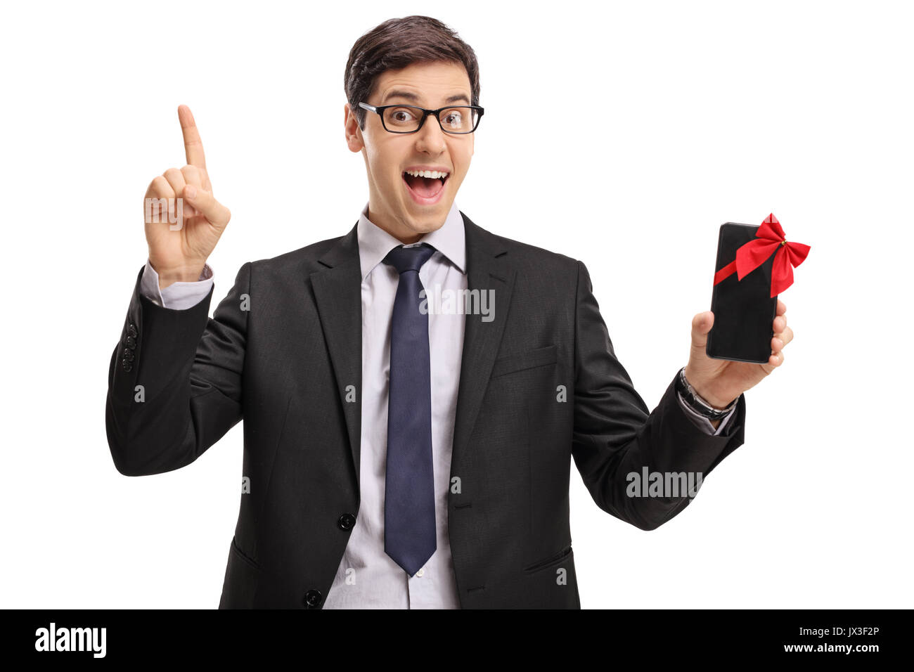 Cheerful businessman showing a phone wrapped with red ribbon as a gift ...