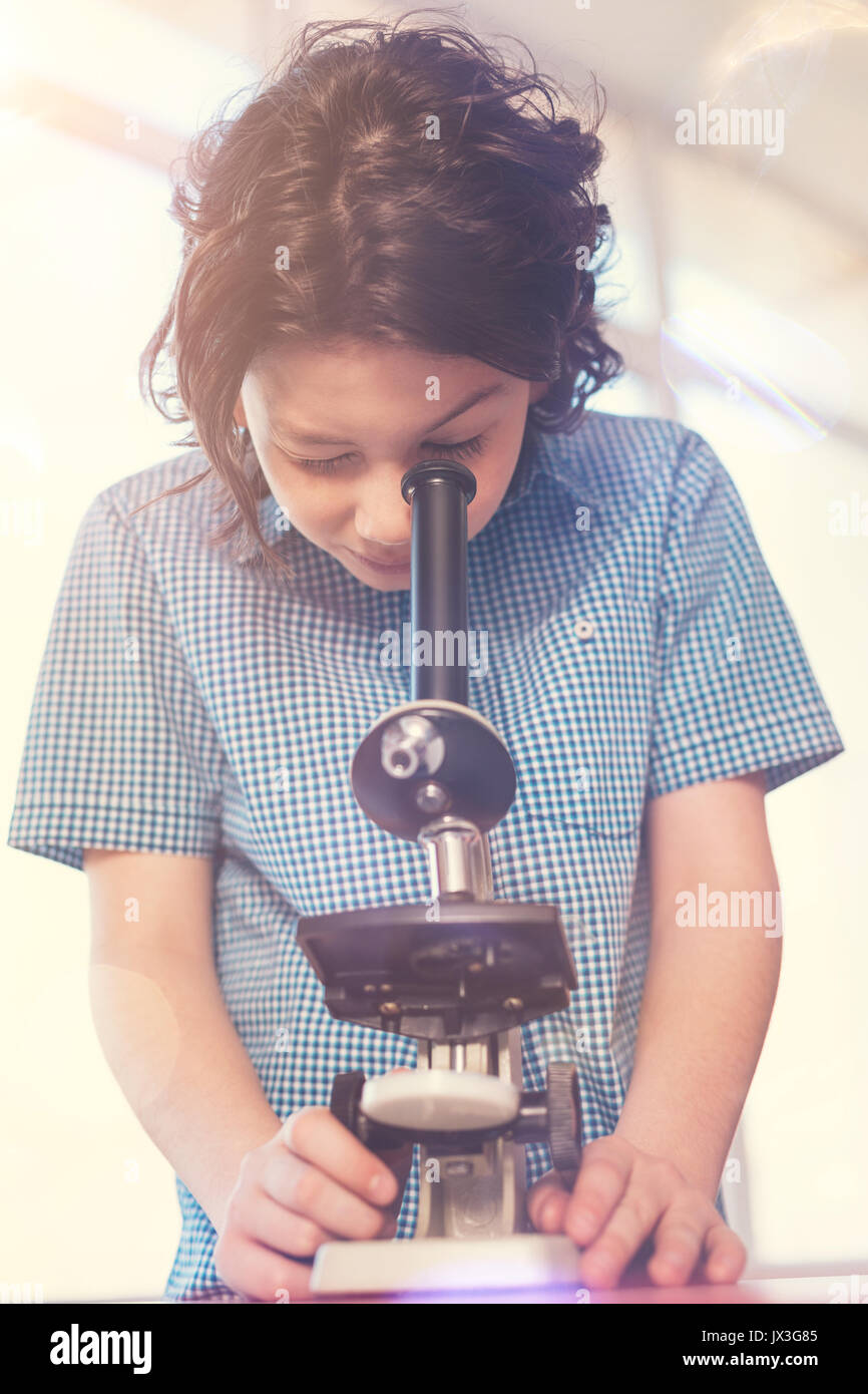 Boy looking through microscope hi-res stock photography and images - Alamy