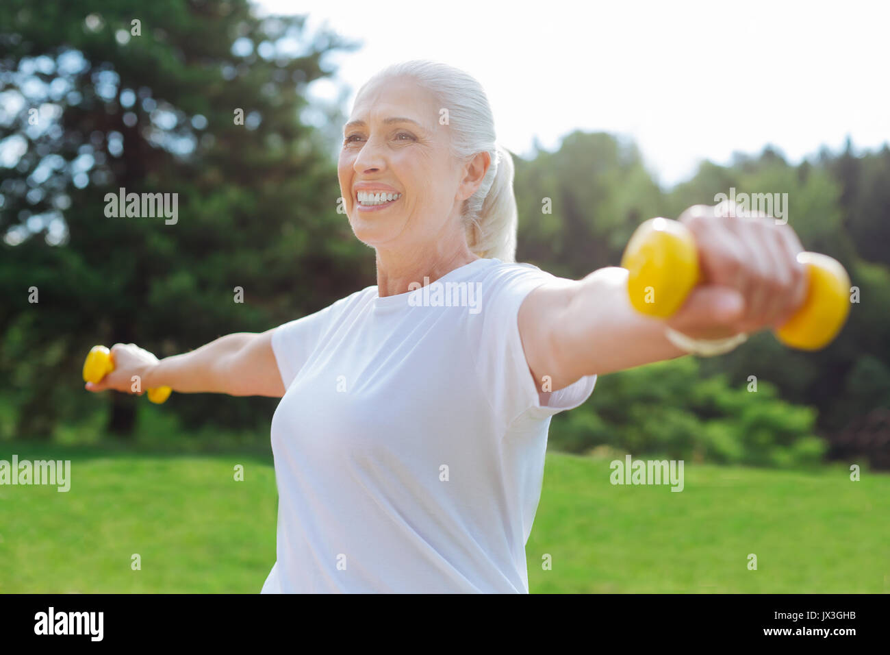 Attractive elderly woman demonstrating her strength Stock Photo - Alamy