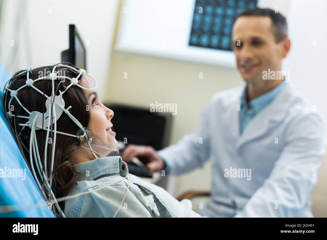 Medical specialist carrying out electroencephalographic diagnostics of ...