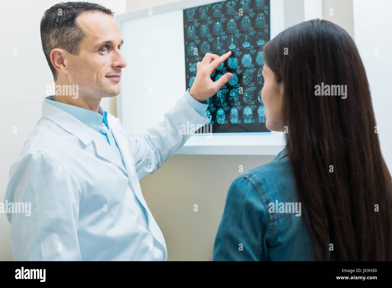 Doctor explaining x ray results hi-res stock photography and images - Alamy