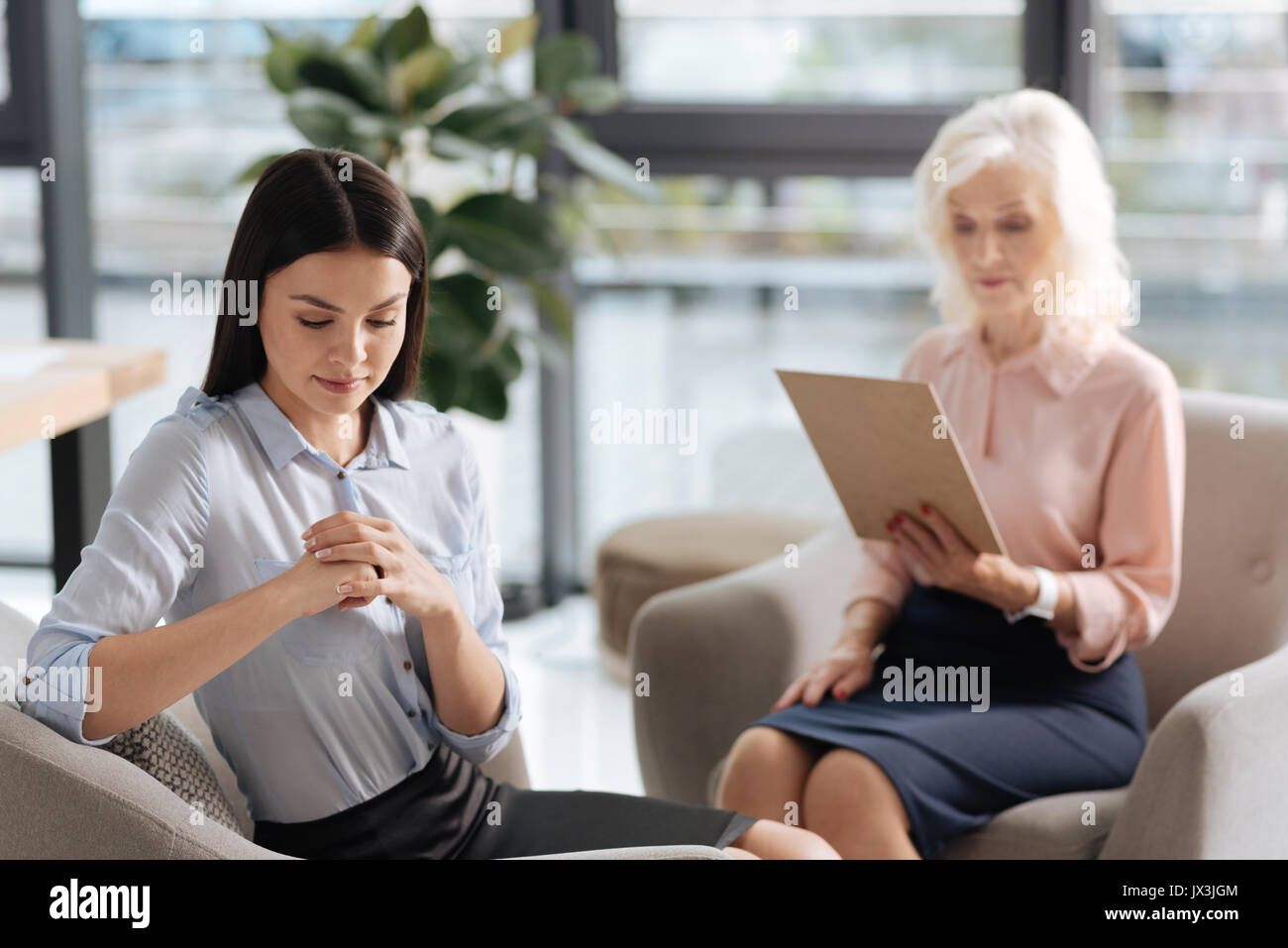 Nice woman feeling nervous Stock Photo - Alamy