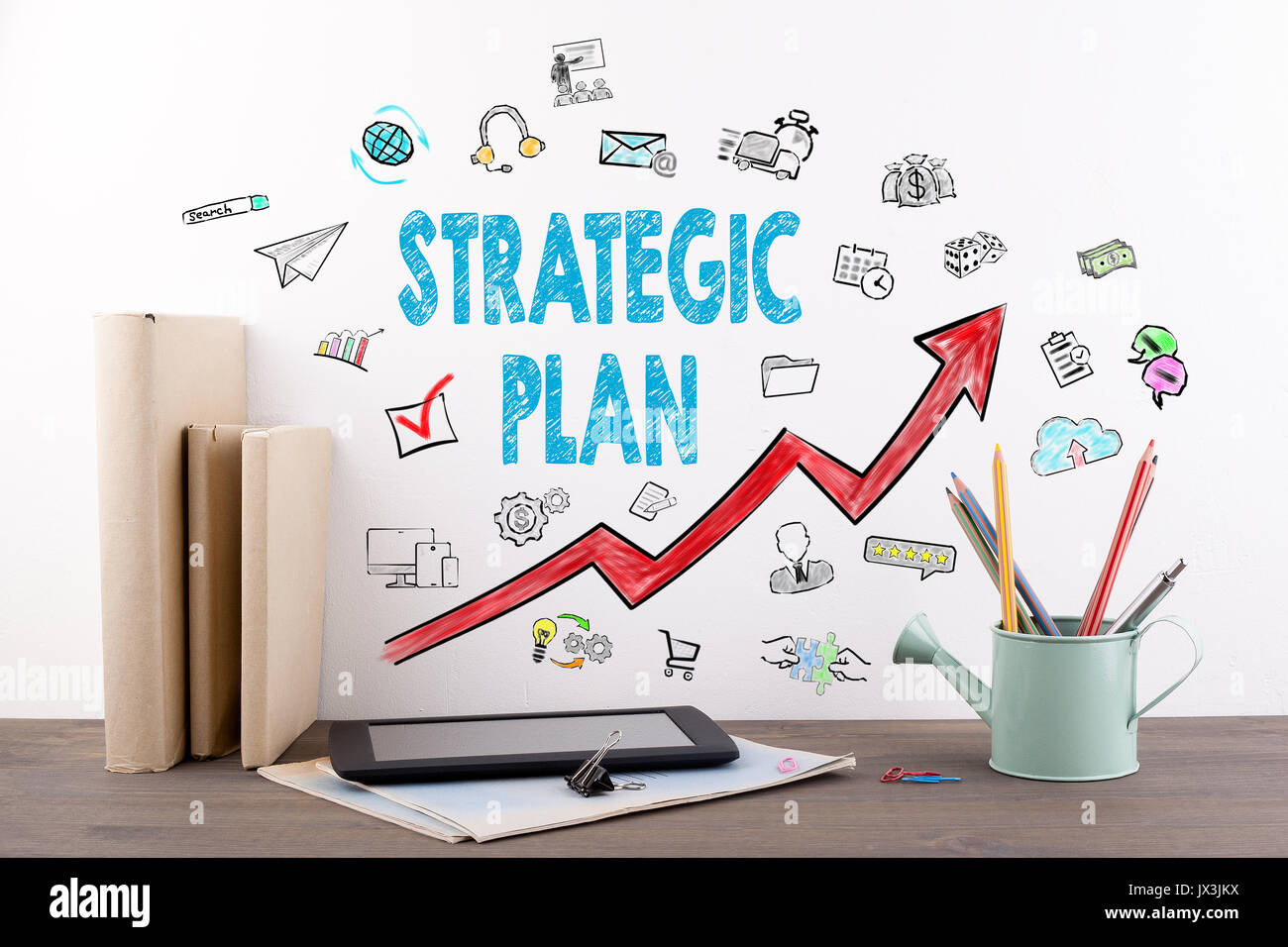 Strategic Plan. Books and stationery on a wooden office desk Stock ...