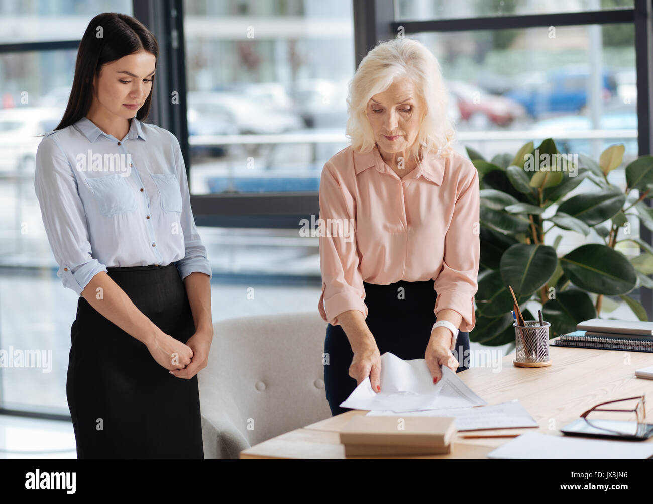 Serious professional businesswoman collecting documents Stock Photo - Alamy