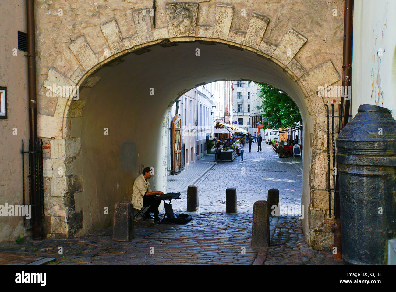 busker at the Swedish gate, Old Town Riga, Latvia Stock Photo - Alamy