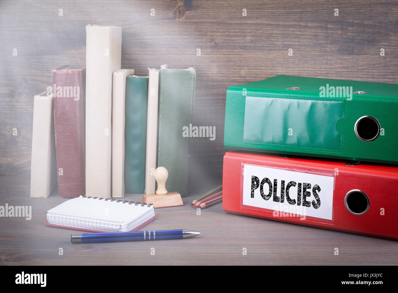 Policies. Binder on desk in the office. Business background Stock Photo ...
