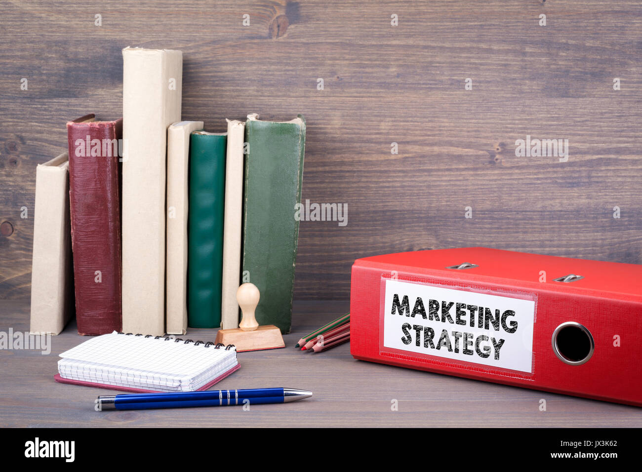 Marketing Strategy. Binder on desk in the office. Business background ...