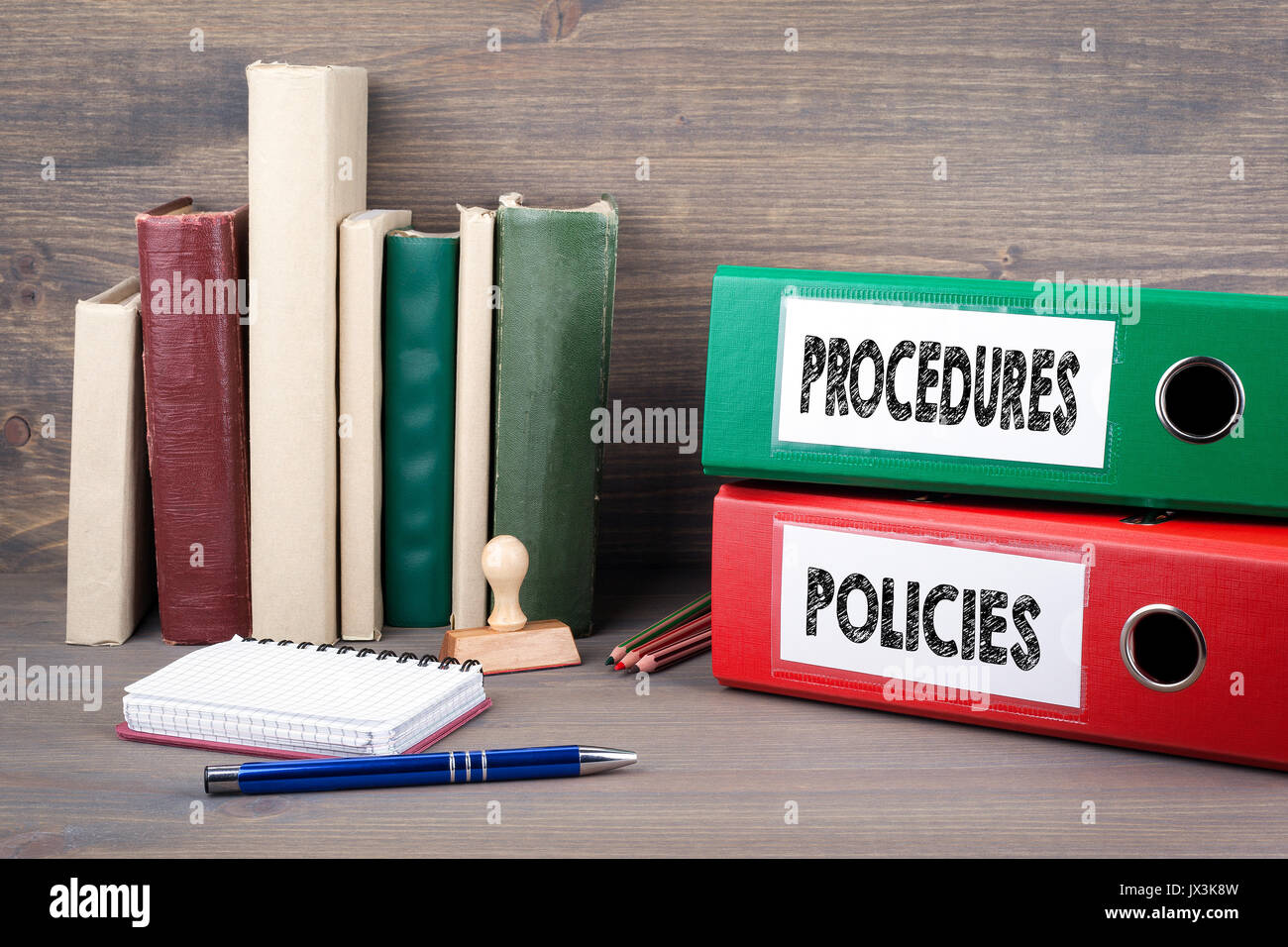Policies and Procedures. Binders on desk in the office. Business ...