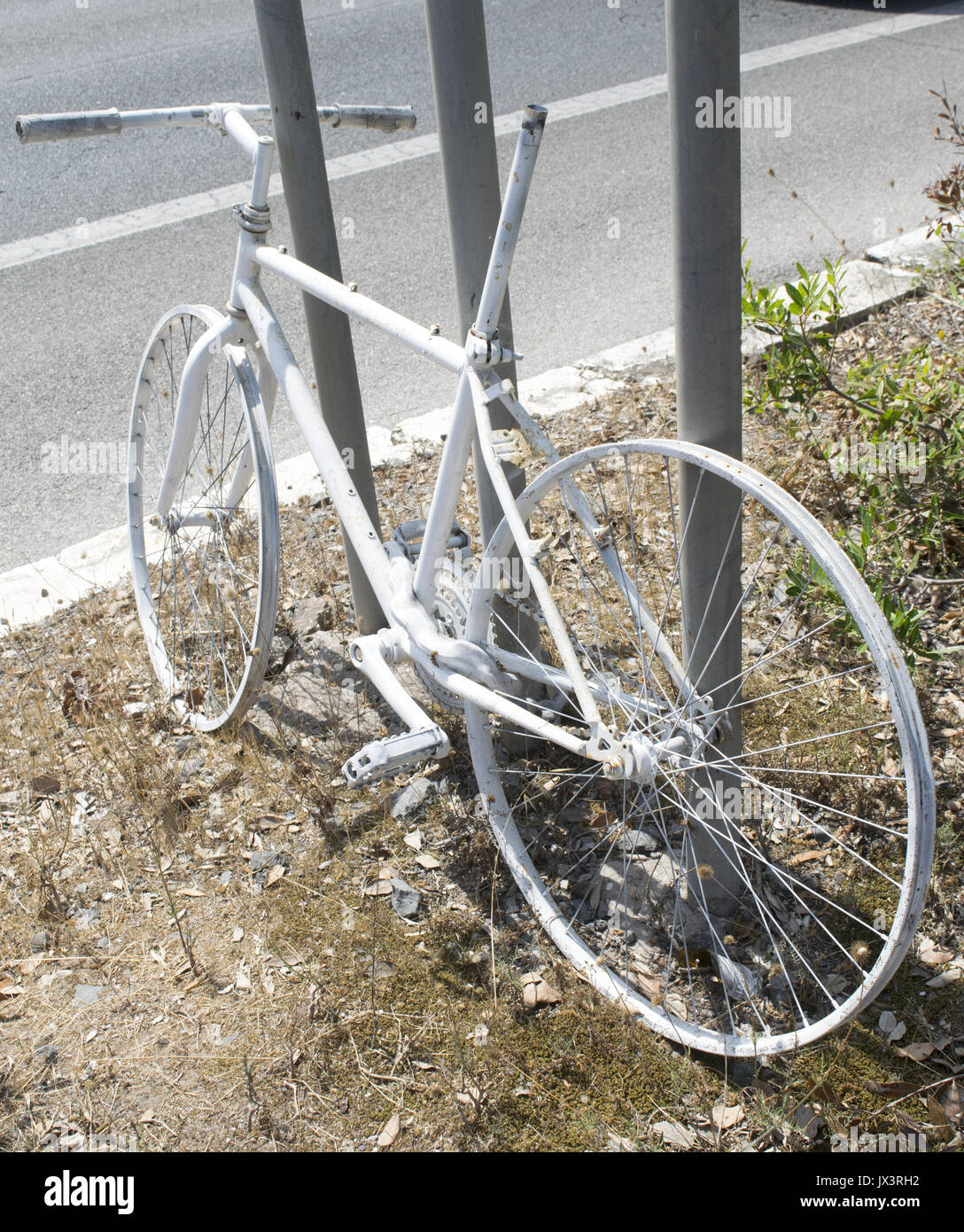 old white cycle abandoned on a edge of a street Stock Photo - Alamy