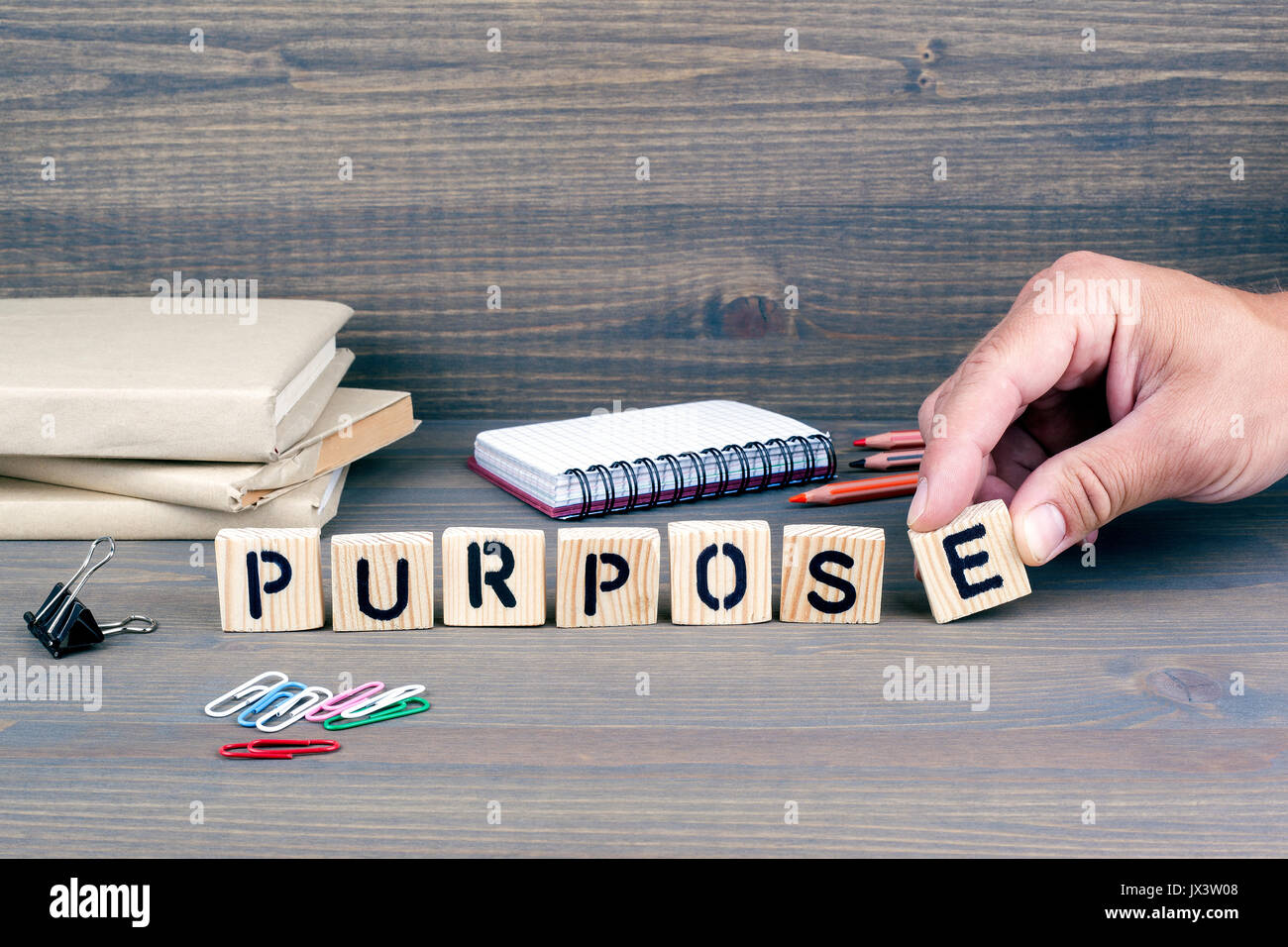 purpose concept.Wooden letters on dark background. Office desk Stock ...