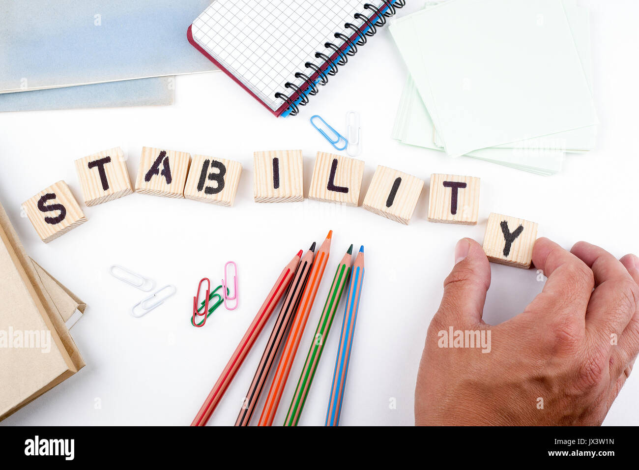Stability concept. Wooden letters on a white background Stock Photo - Alamy