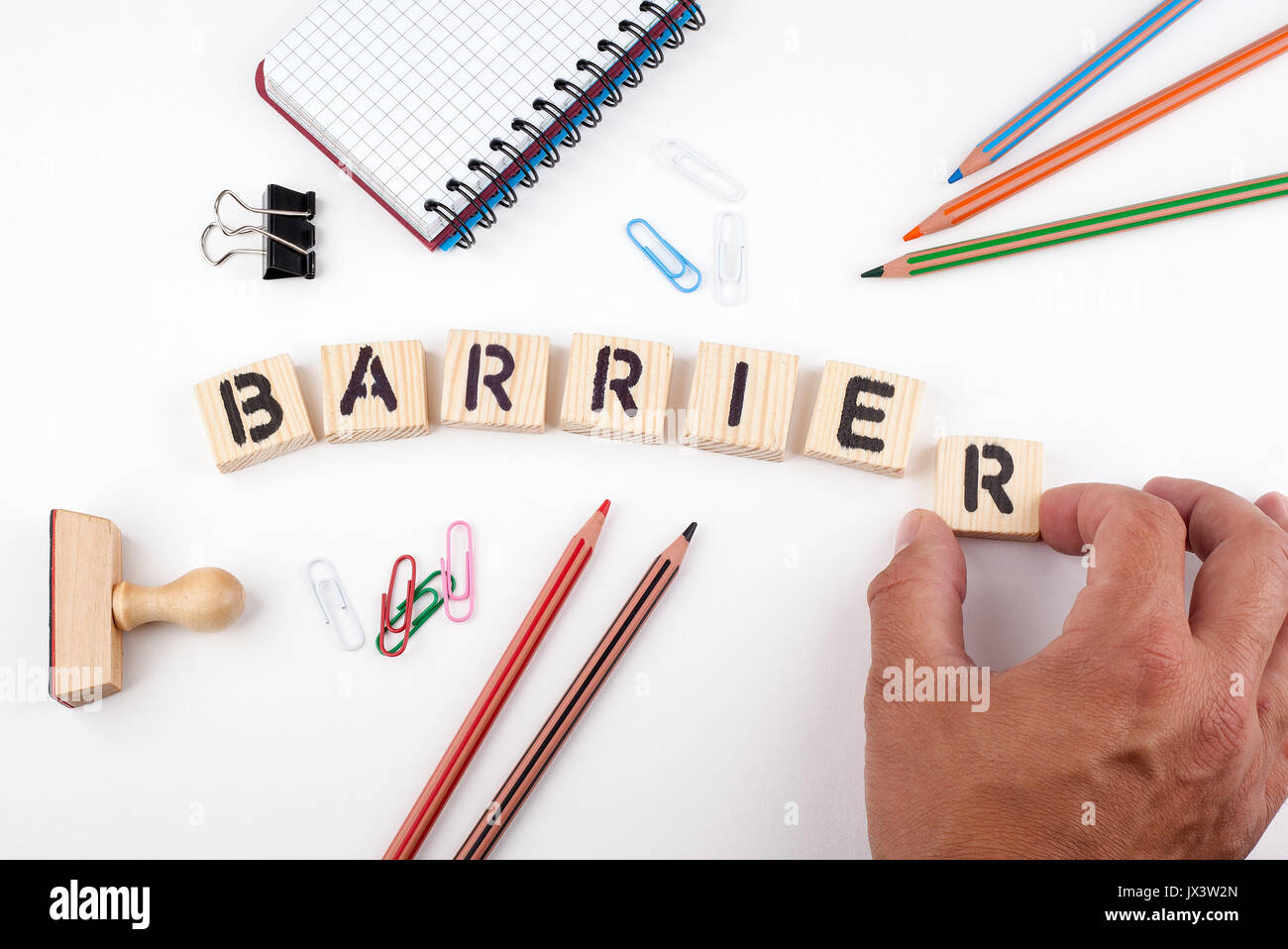 Barrier concept. Wooden letters on a white background Stock Photo - Alamy
