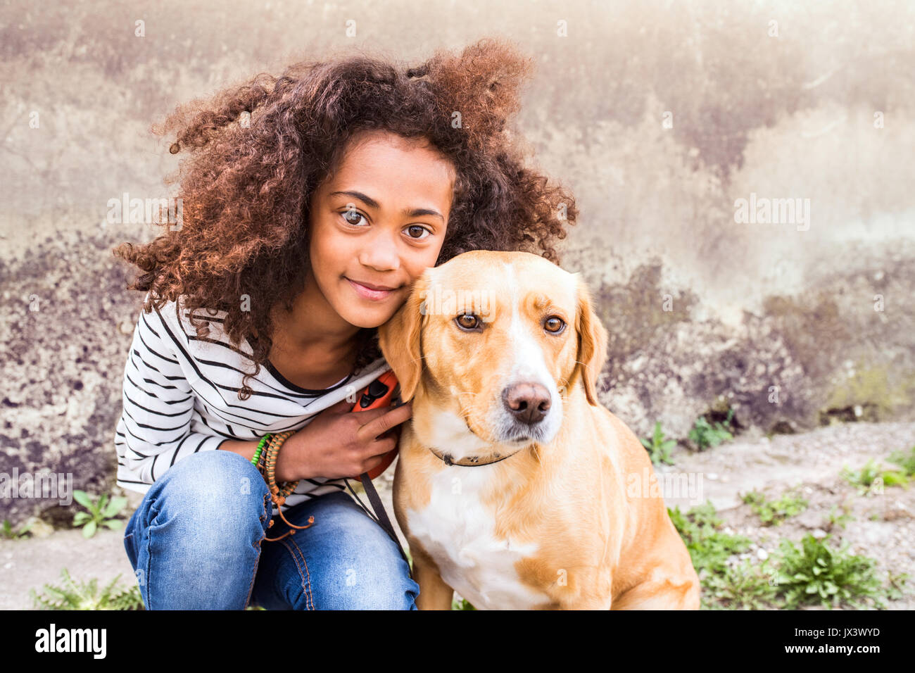 Beautiful african american girl with curly hair outdoors with her cute ...