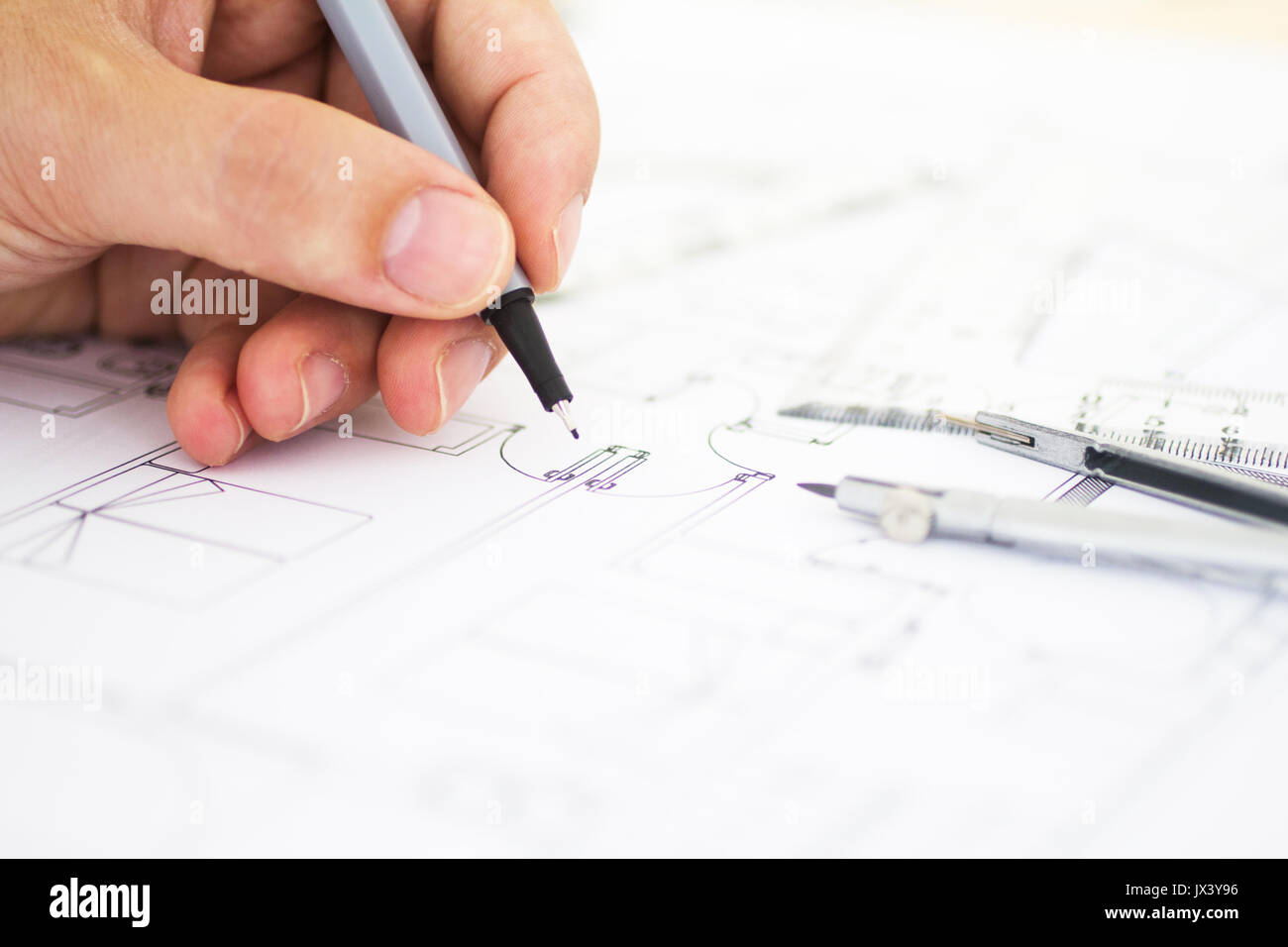 architect working drawing construction plans Stock Photo - Alamy