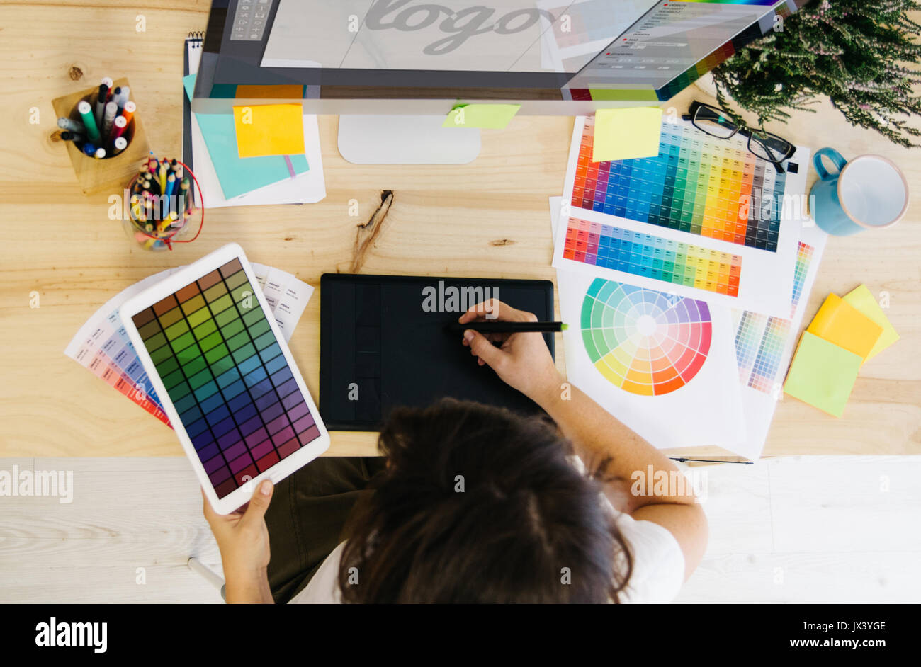 girl designing a logo at design studio Stock Photo - Alamy