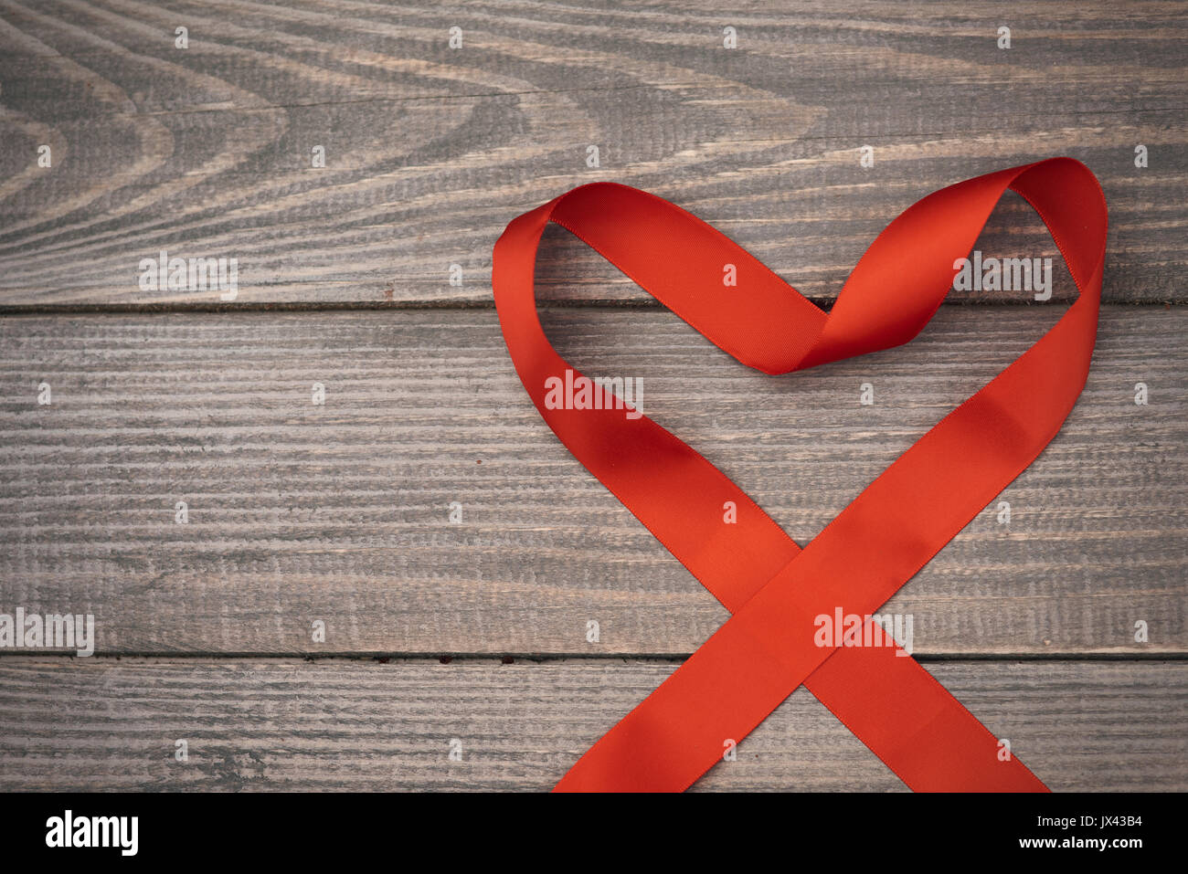 Red ribbon in the shape of heart Stock Photo - Alamy