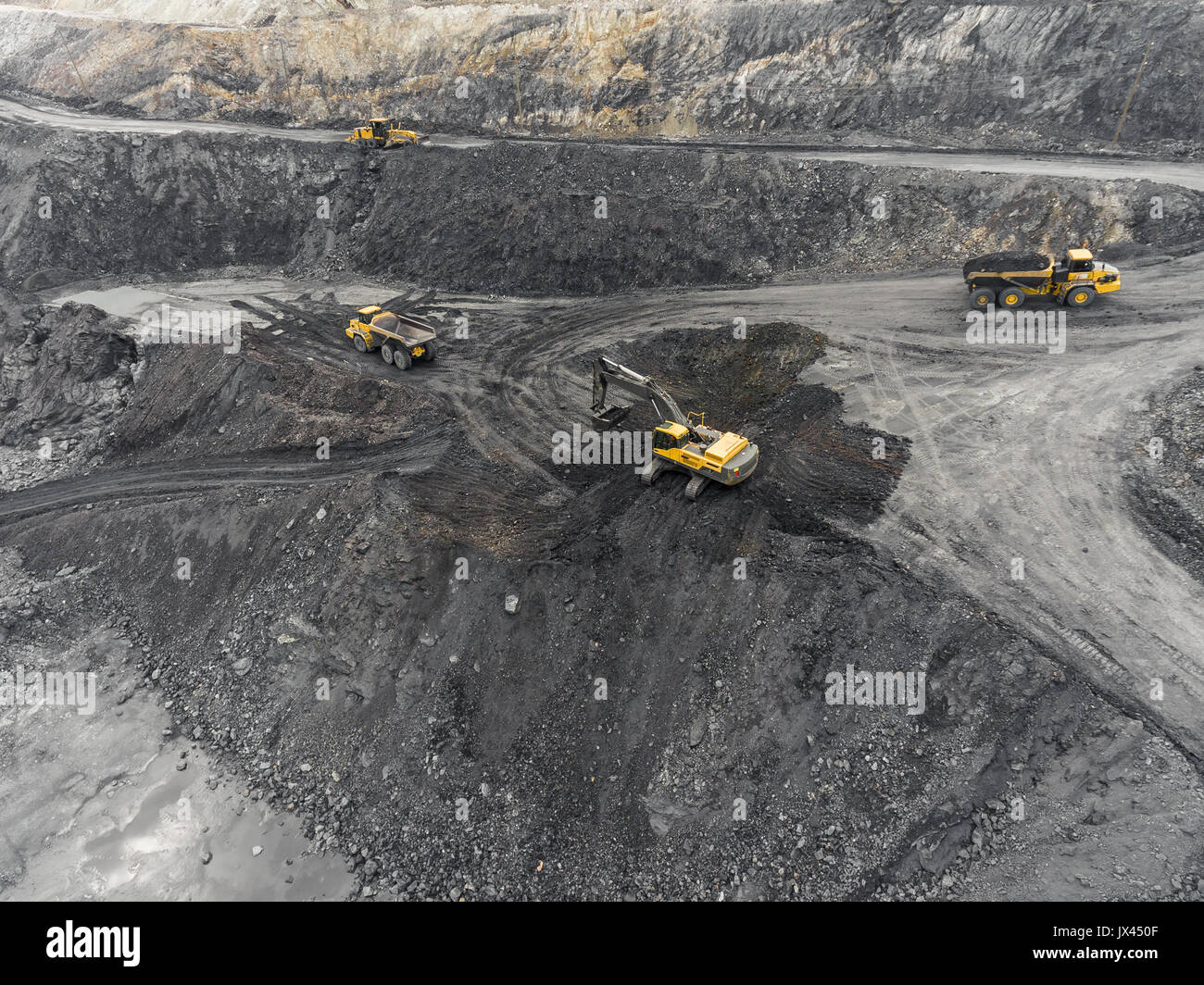 Aerial view open pit mine, loading of rock, mining coal, extractive ...