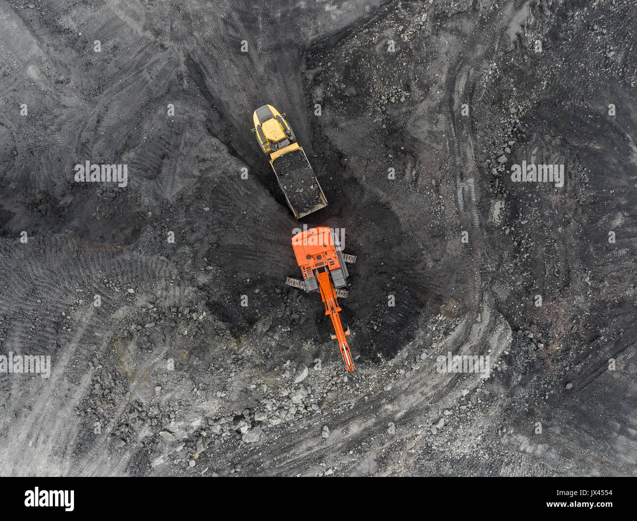 Aerial view open pit mine, loading of rock, mining coal, extractive ...