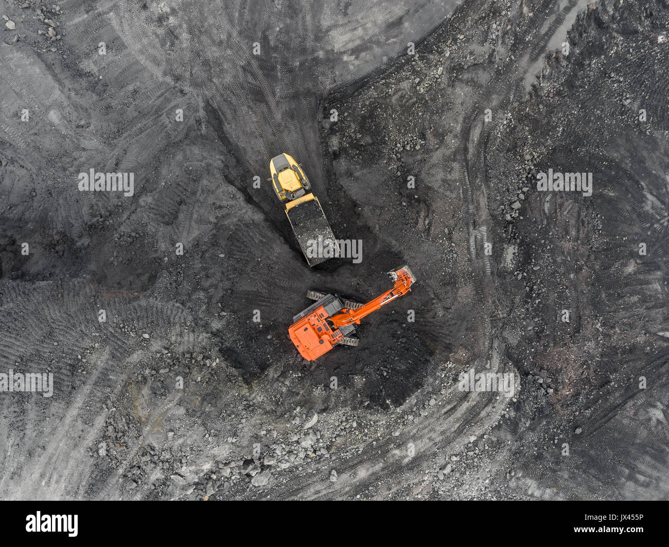 Aerial view open pit mine, loading of rock, mining coal, extractive ...