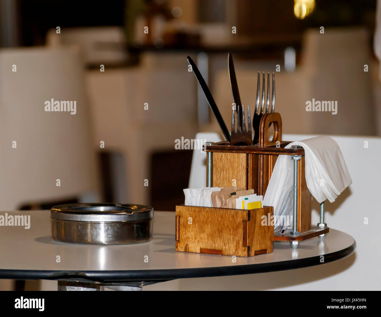 Table set and ashtray on the table of a street bar Stock Photo - Alamy