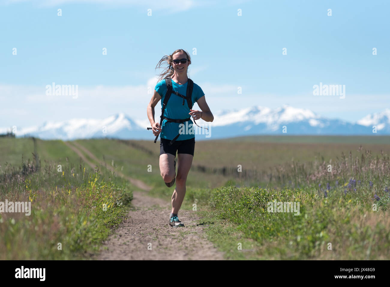 Fitness woman running on mountains hi-res stock photography and images ...