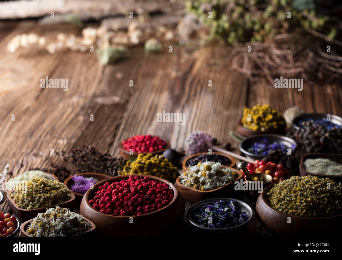 Fresh medicinal healing herbs on the wooden table Stock Photo - Alamy