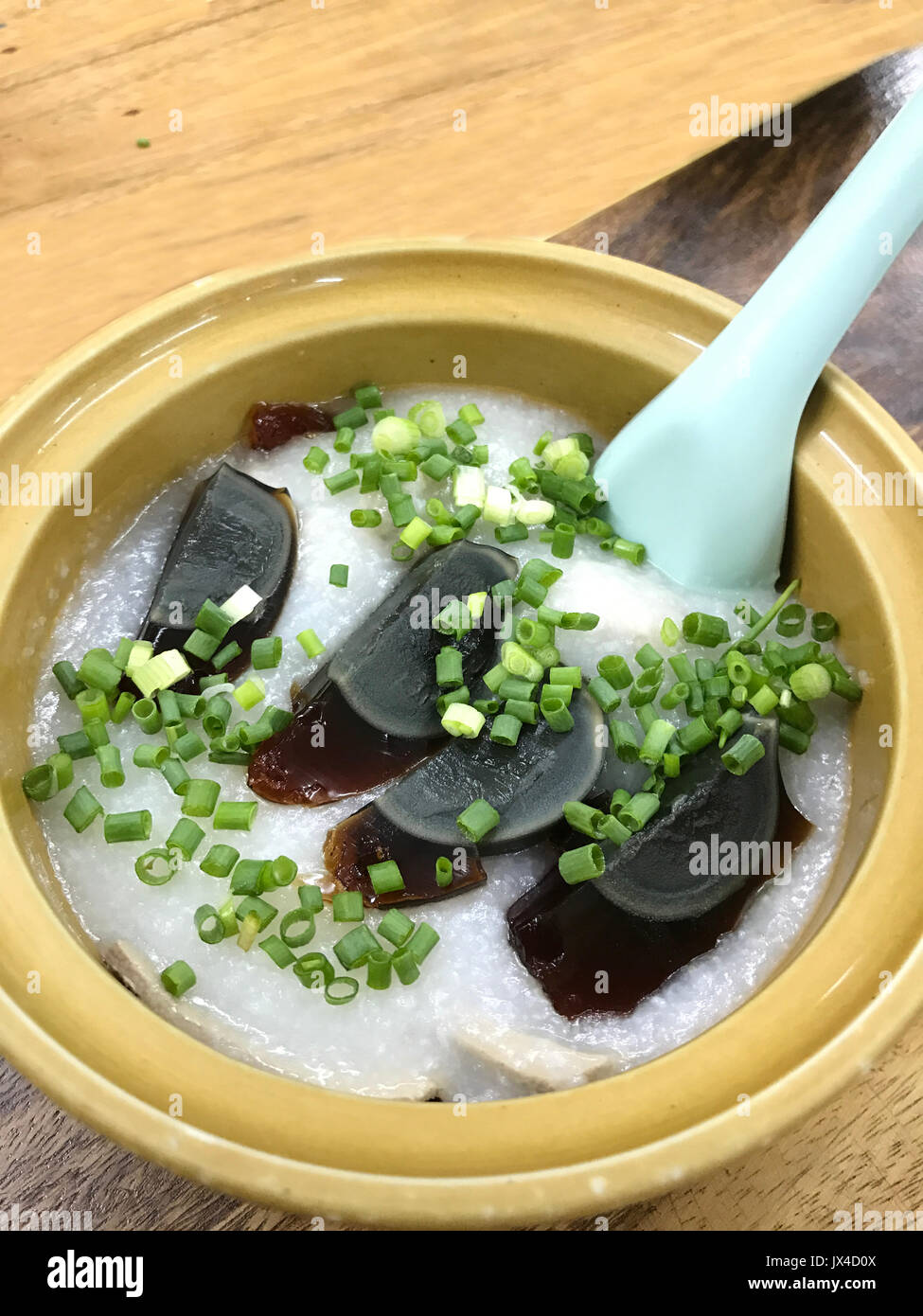 Congee, Rice Porridge, Rice Gruel, Conjee or Rice Soup topped with ...
