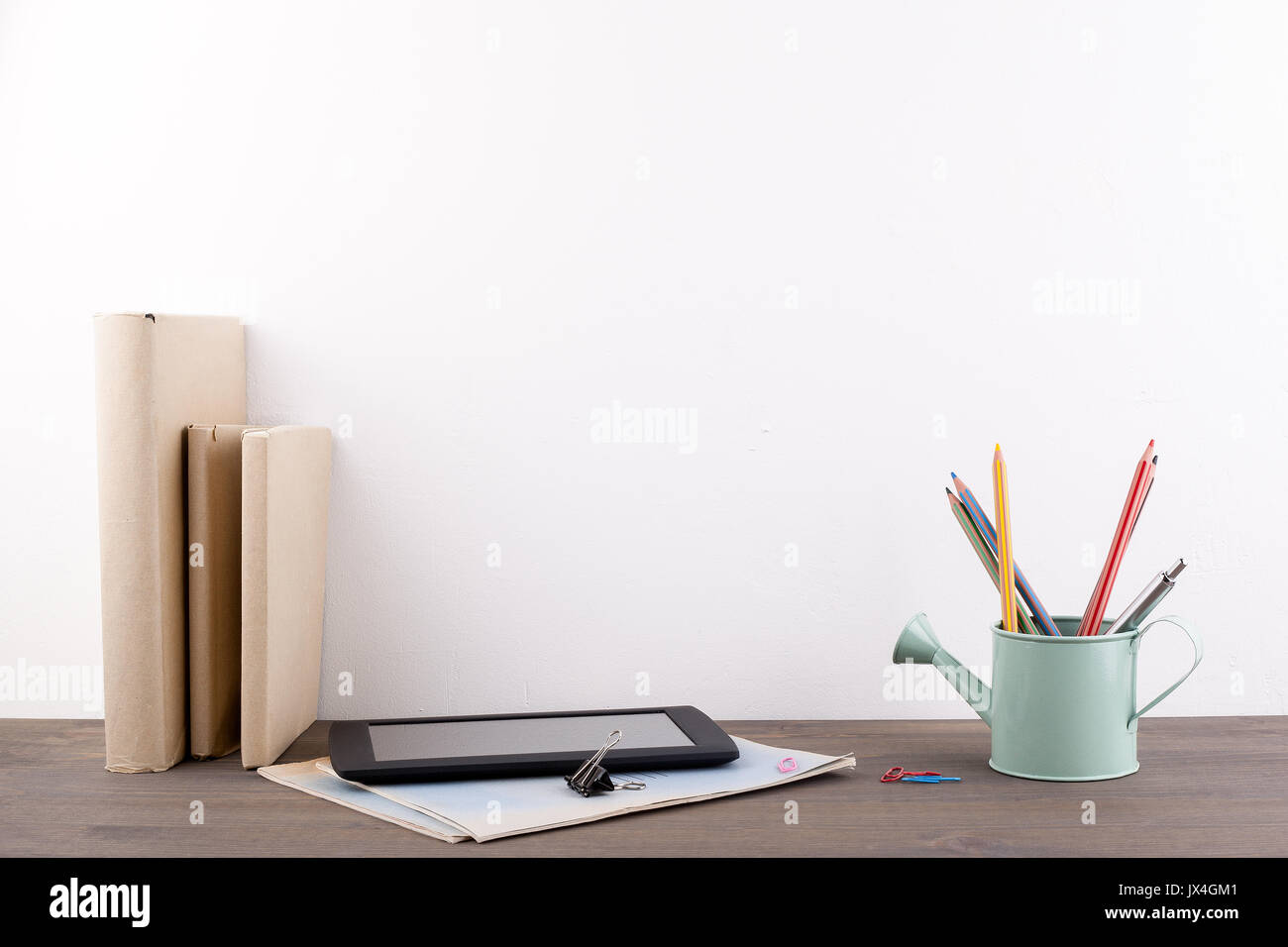 Books and stationery on a wooden office desk Stock Photo - Alamy