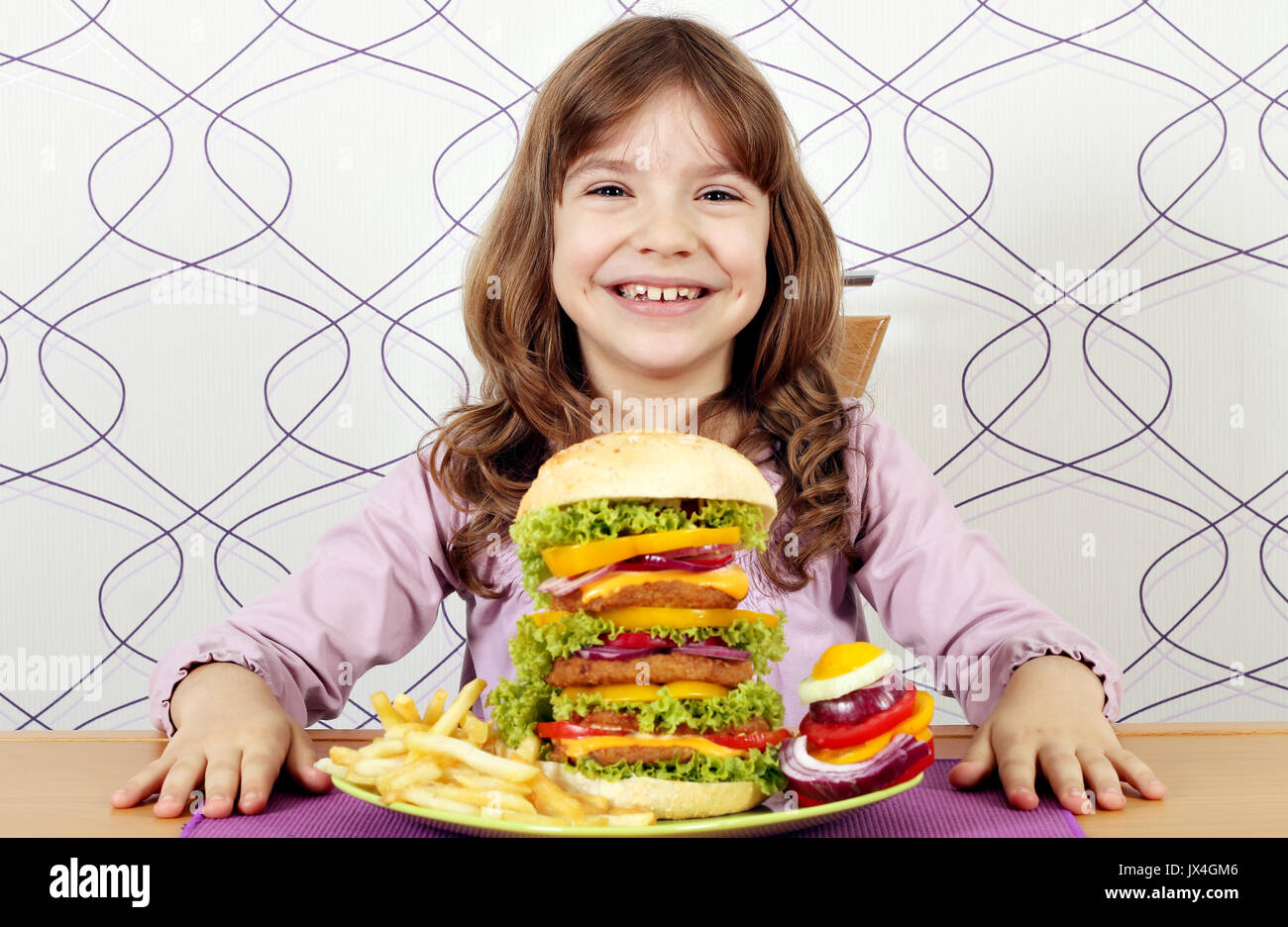 happy little girl with big hamburger Stock Photo - Alamy