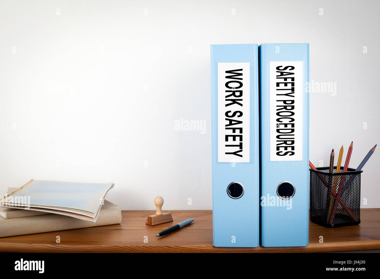 Work Safety and Safety Procedures binders in the office. Stationery on ...