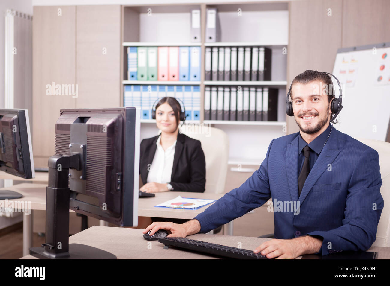 Office of customer support line with people working in it Stock Photo ...