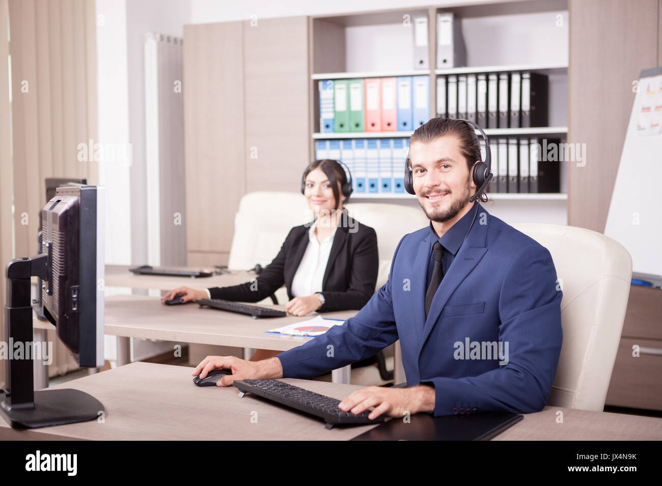 Office of customer support line with people working in it Stock Photo ...
