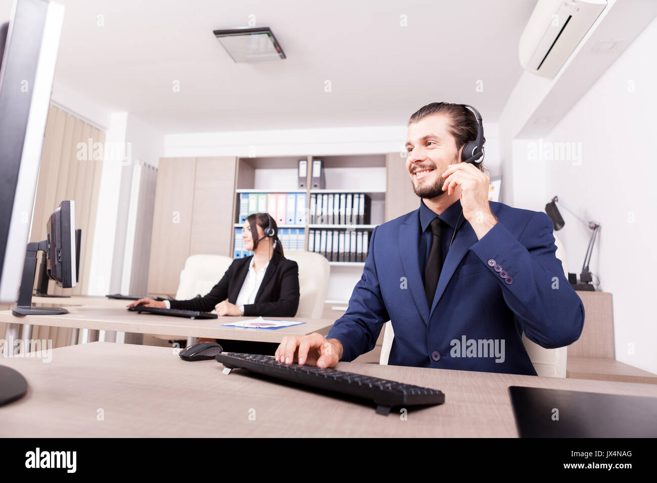 Portrait of man from customer support line in the office Stock Photo ...