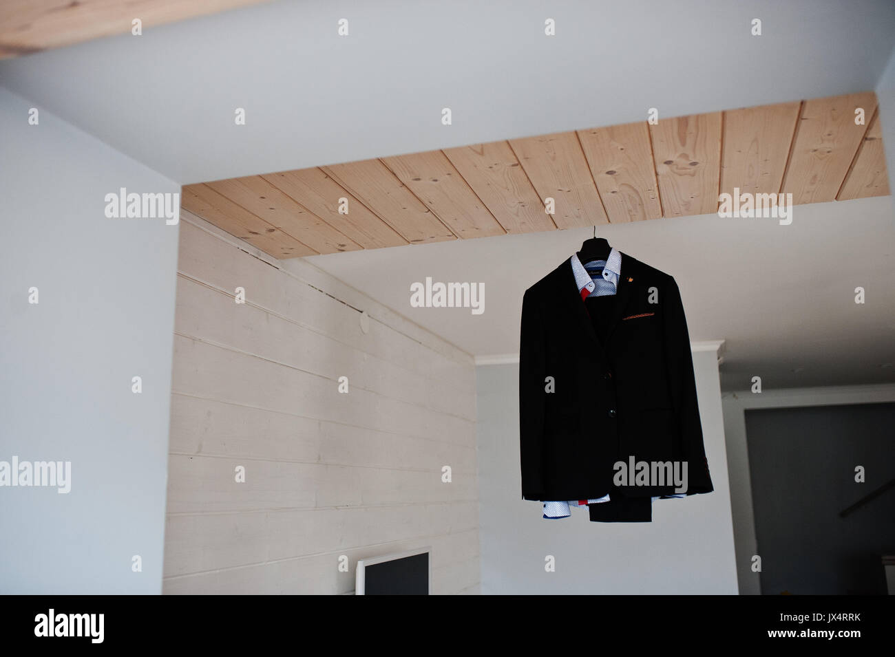 Person hanging on coat hanger hi-res stock photography and images - Alamy