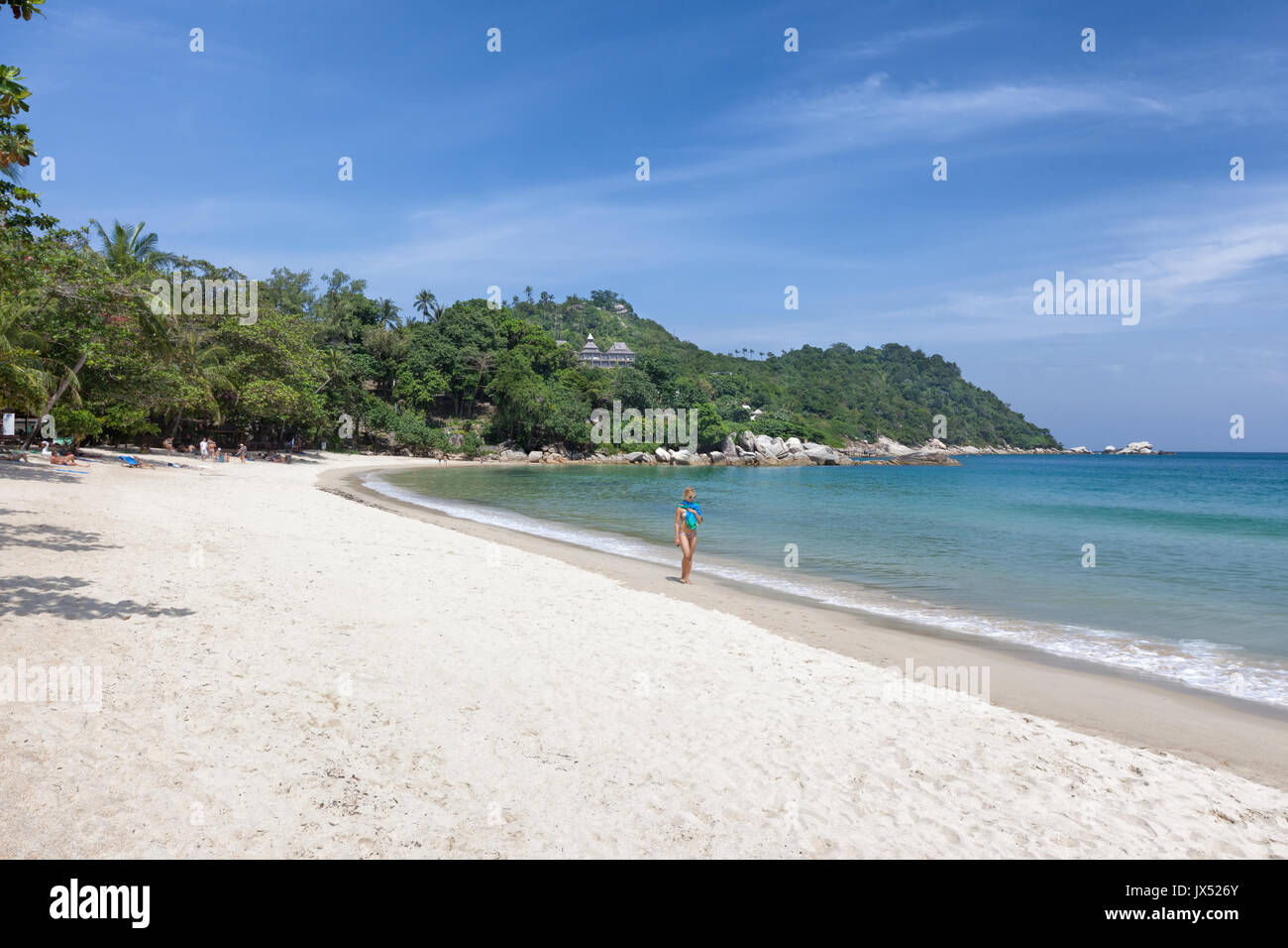 A lone woman walking on Thong Nai Pan Noi Beach, Koh Phangan island ...