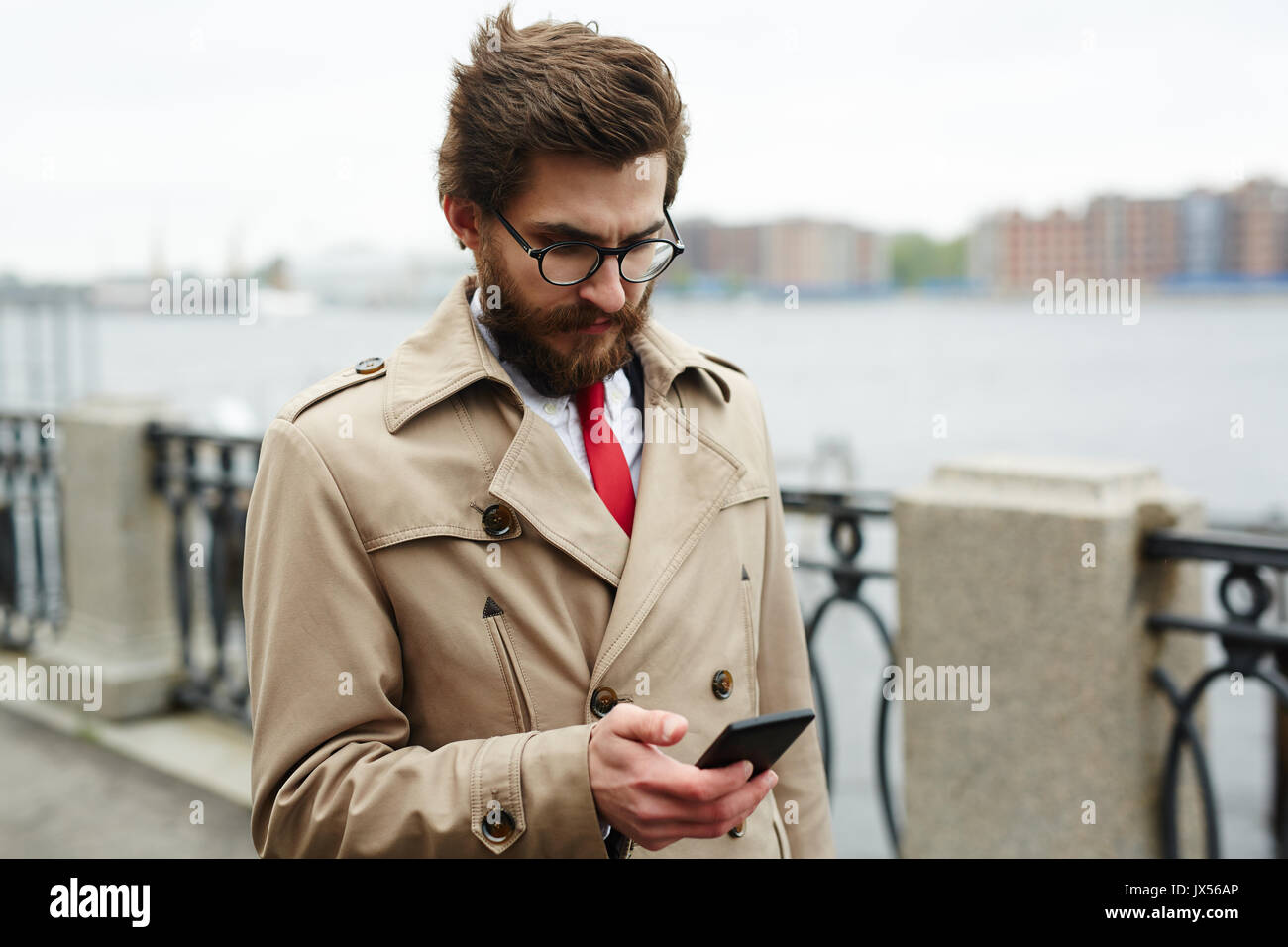 Trench coat salesman hi-res stock photography and images - Alamy